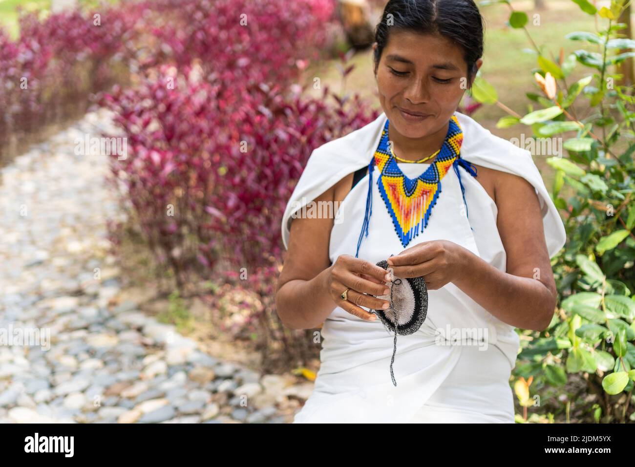 indigenous woman from the Sierra Nevada de Santa Marta making ...