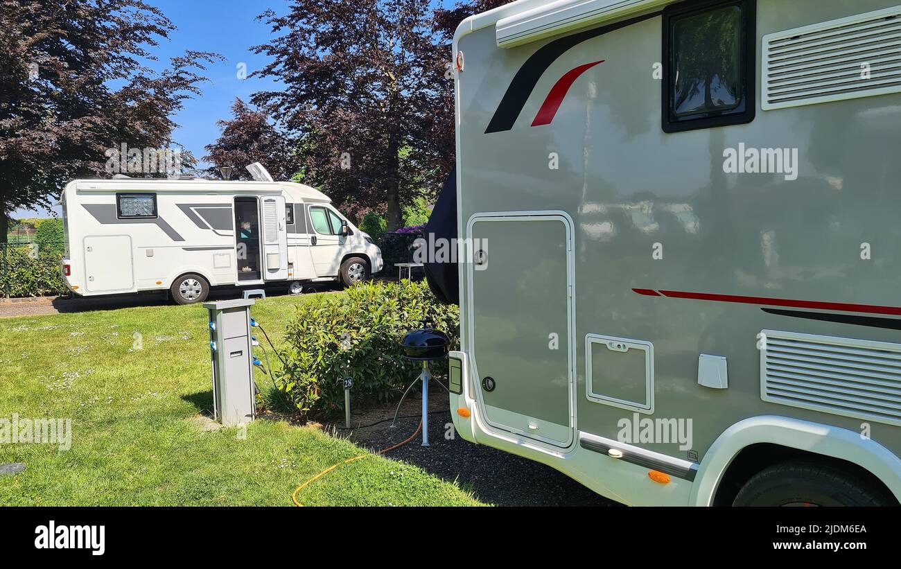 Campers parked on a Camer Van pitch. Concept camper van leisure and fun ...