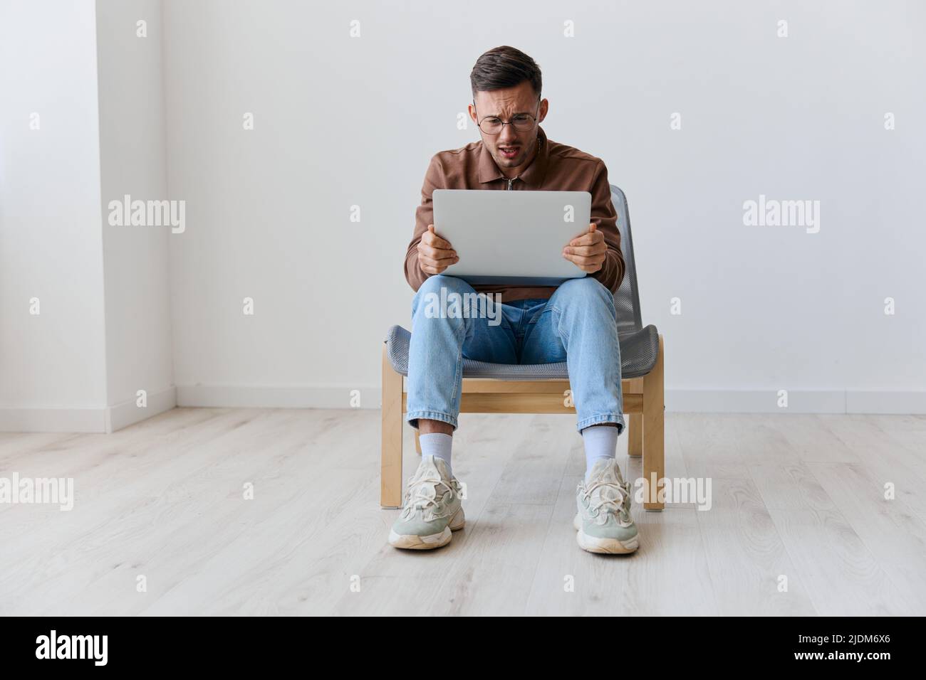 Male student opening laptop typing hi-res stock photography and images ...