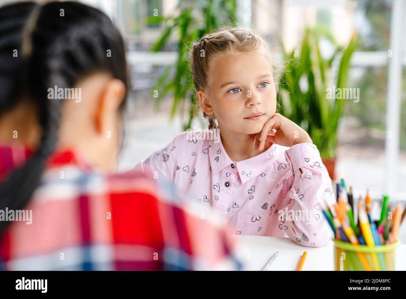 Multiracial two girls drawing during class in art school indoors Stock ...