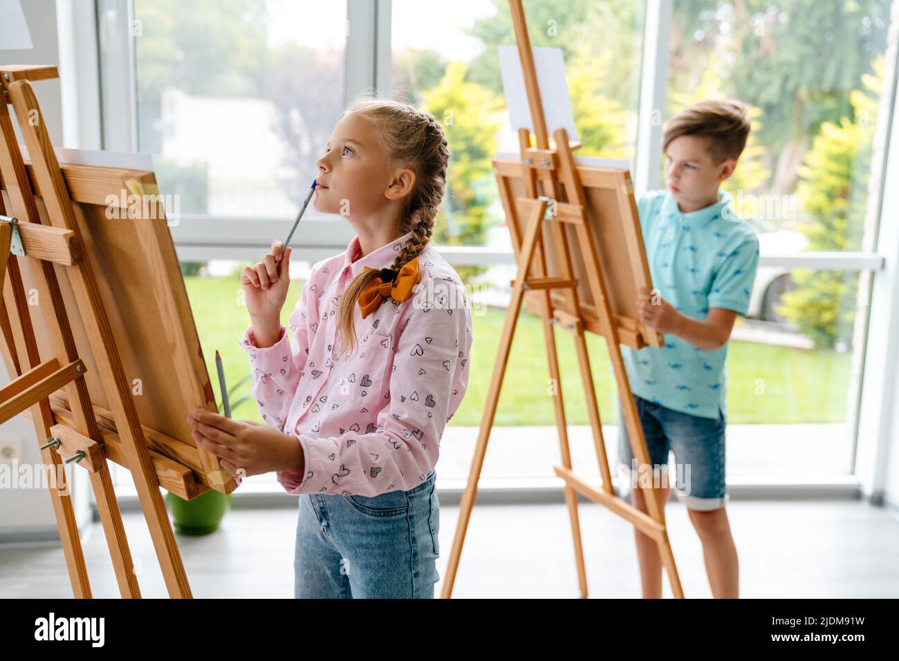 White students drawing during class in art school indoors Stock Photo ...