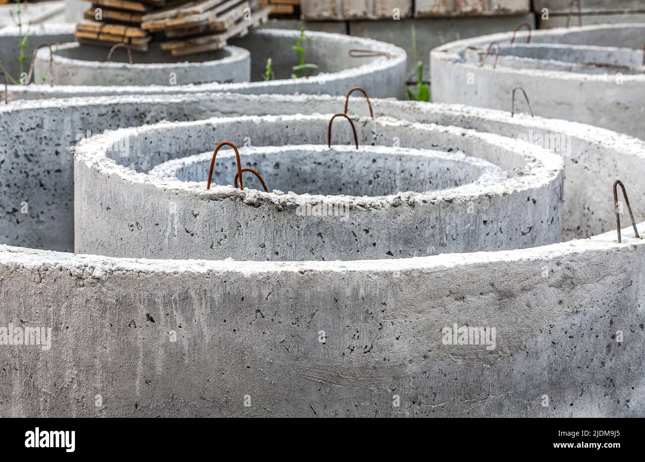 Round reinforced concrete rings at a construction site. Reinforced ...