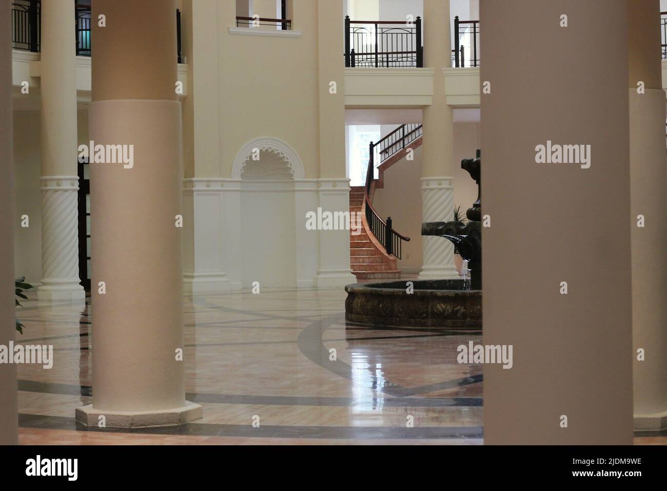 The interior of a huge and elegant dome with lots of columns and space ...