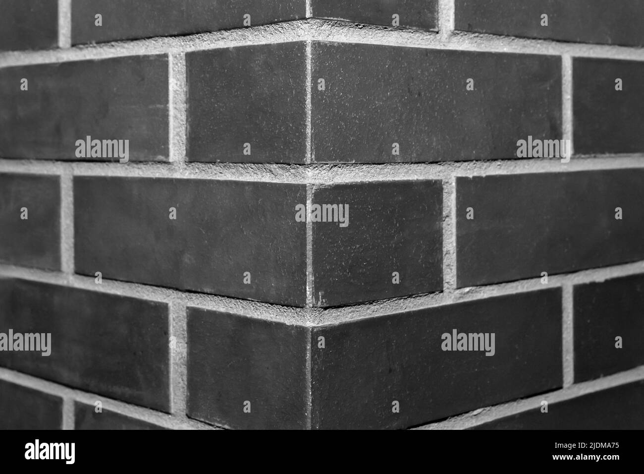 Corner brick column fragment close-up architecture of the joint dark ...
