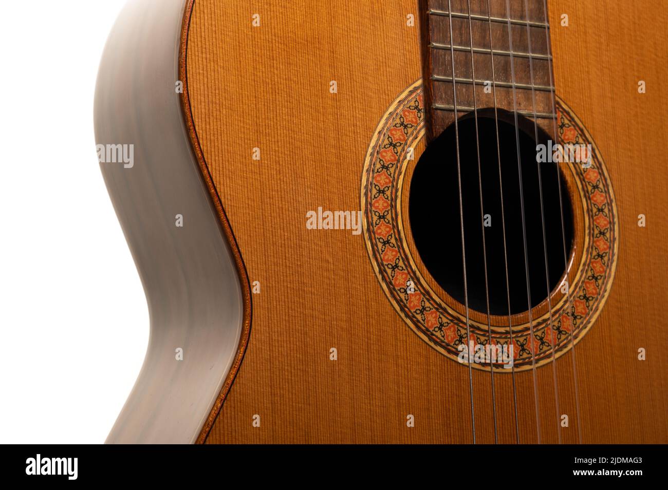Classical guitar body, fretboard, sound hole isolated up close on a brilliant white background ...