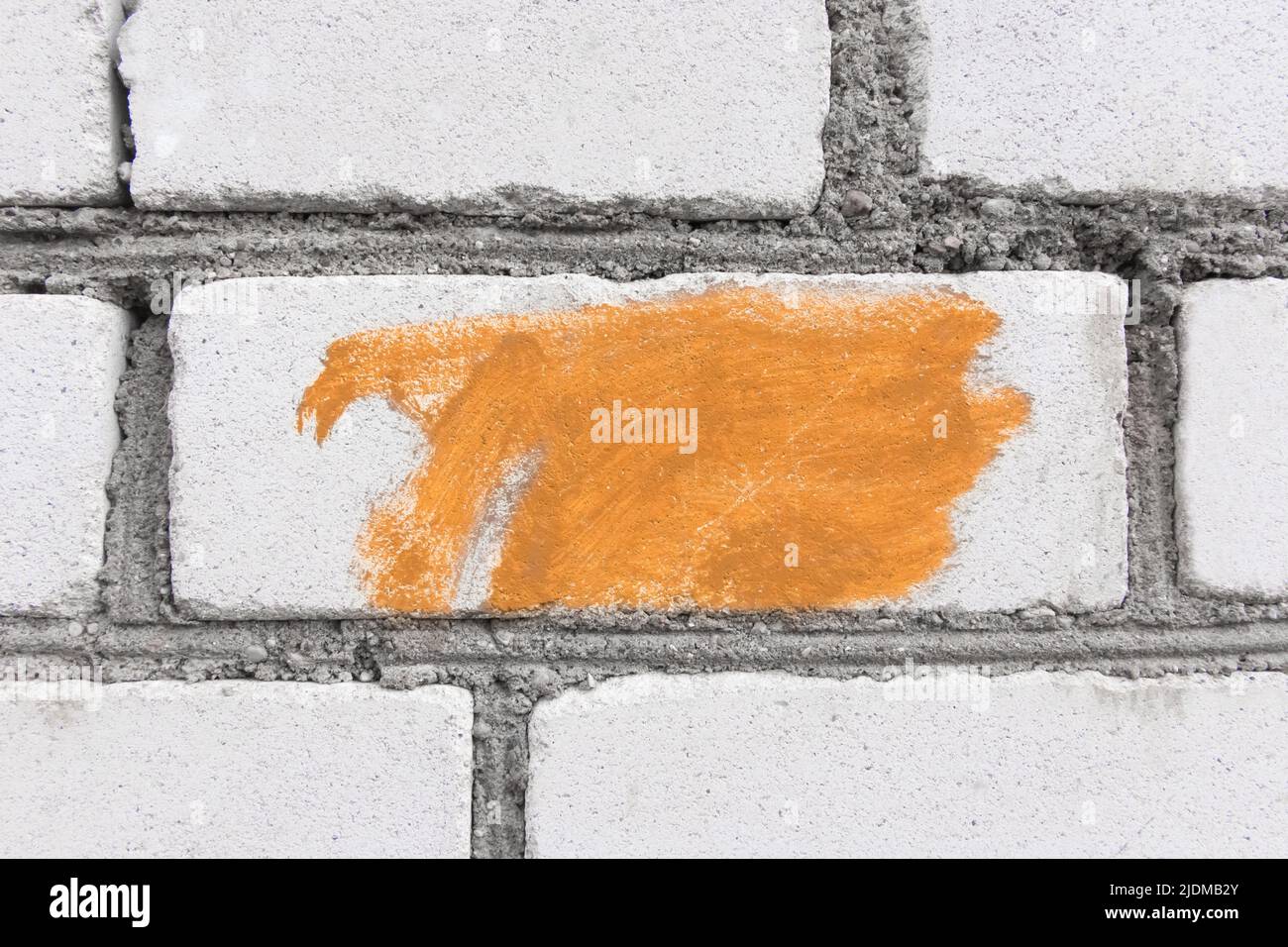 Orange or brown paint spot brush stain abstract pattern art urban wall ...