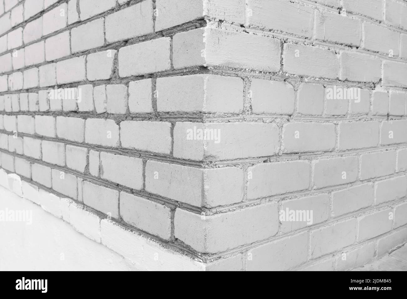 Corner brick fragment close-up architecture of the joint grey white ...