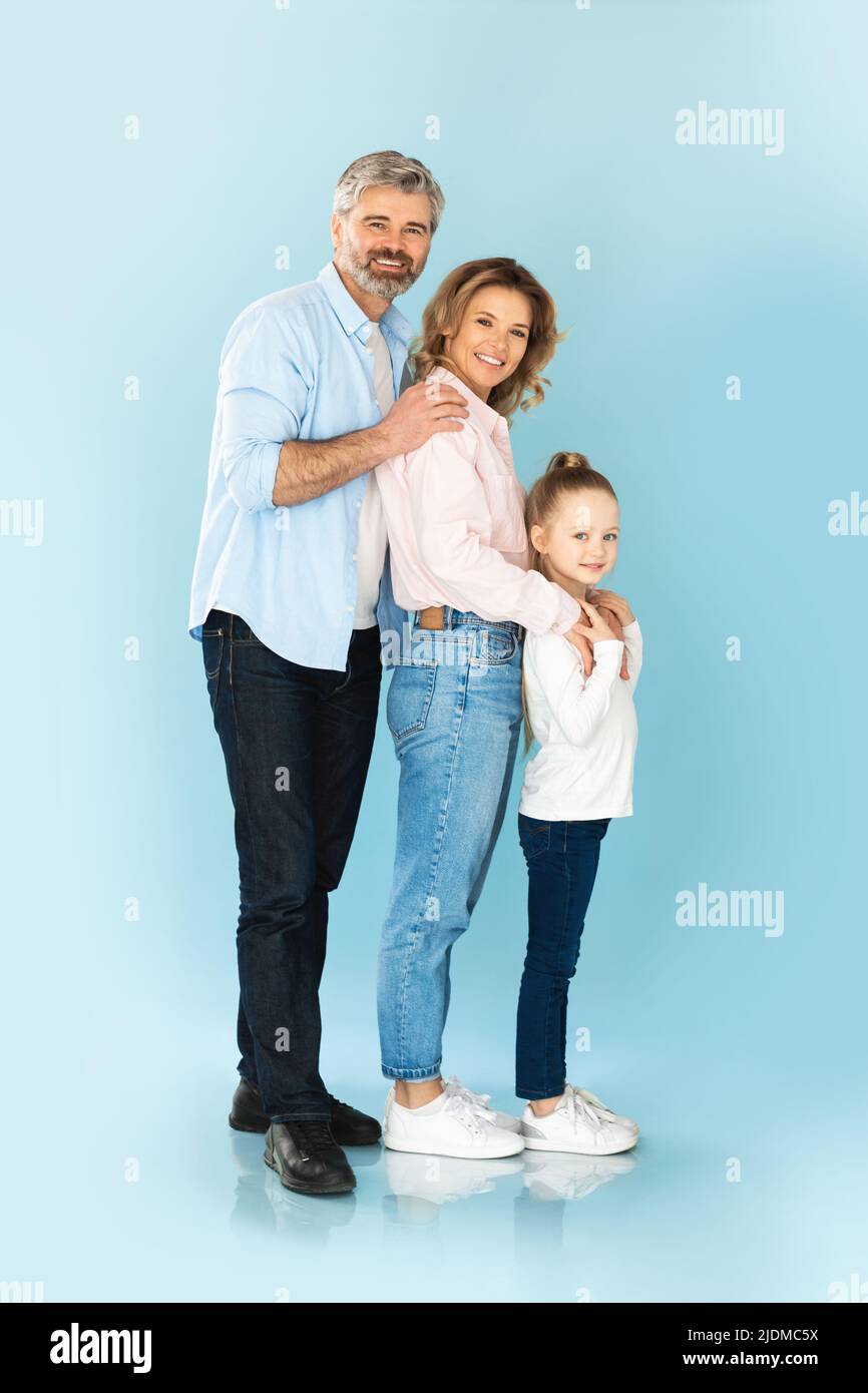 Parents hug child hi-res stock photography and images - Alamy