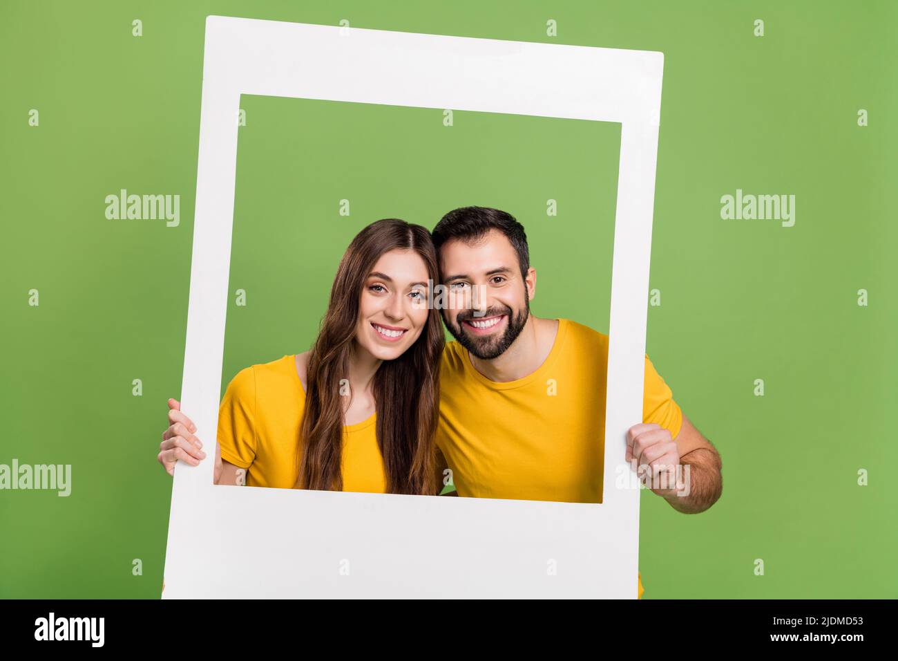 Photo of two cheerful nice partners hands hold paper album set card ...