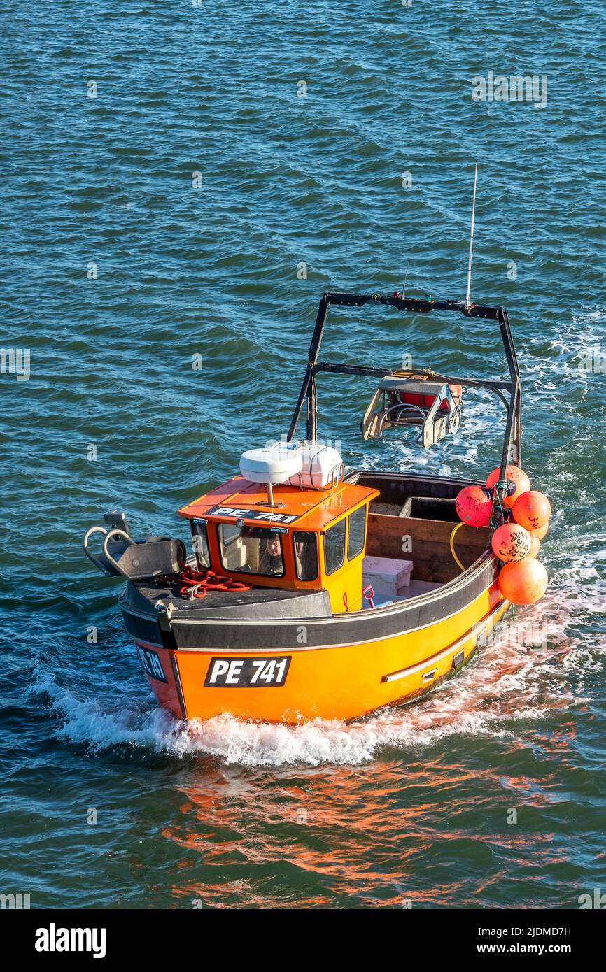 inshore fishing trawler underway on the solent after a day at sea ...