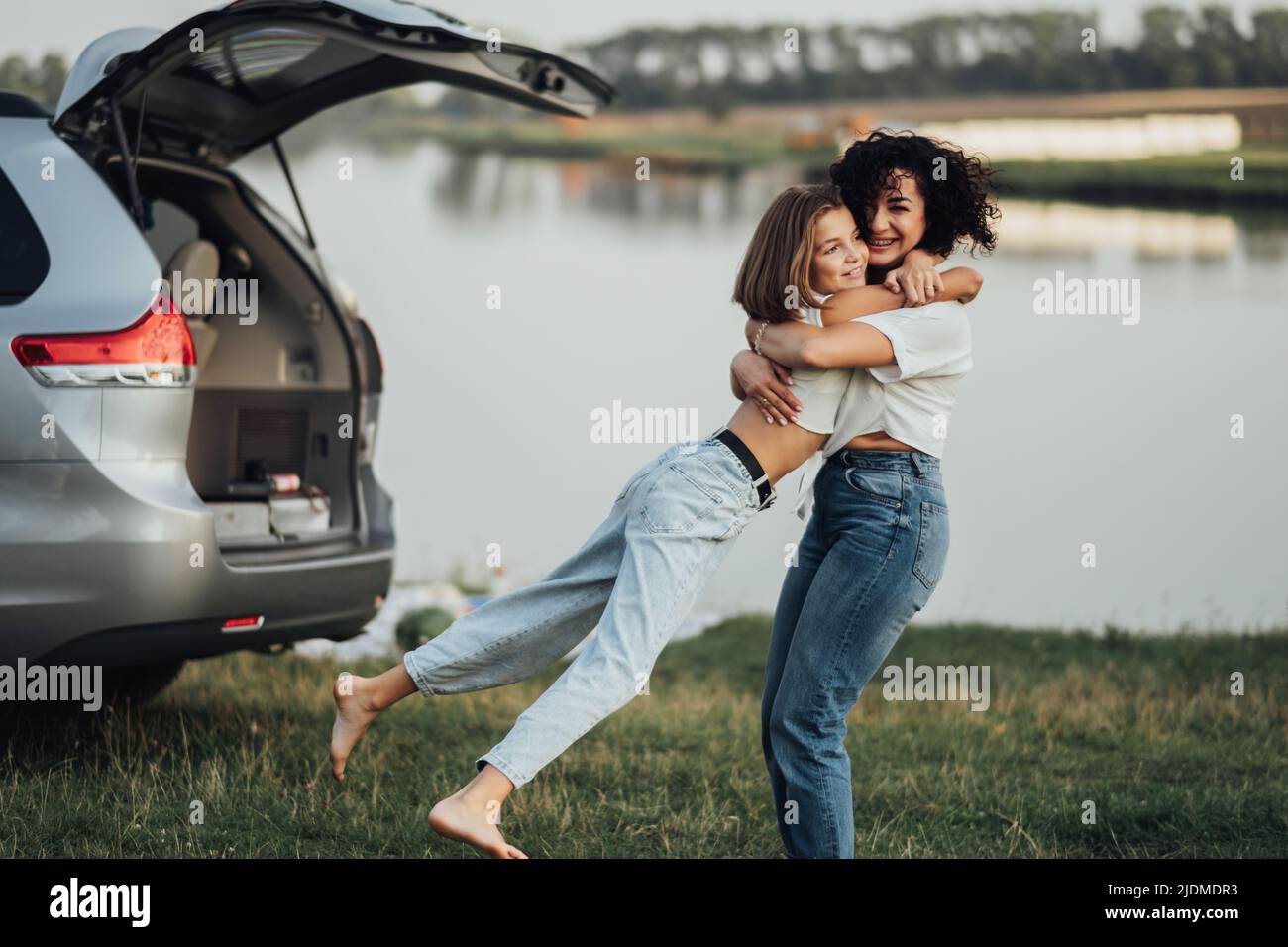 Happy Mother's Day, Woman Hugging with Cheerful Teenage Daughter ...