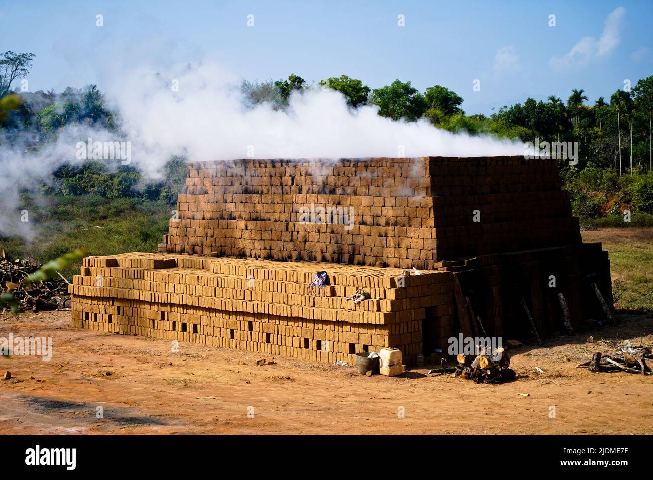 Drying and burning of bricks made of clay with fire wood, traditional ...