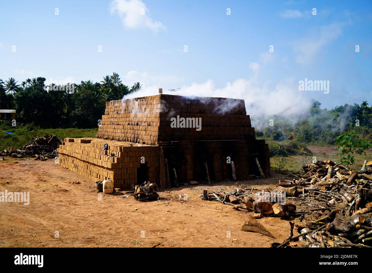 Drying and burning of bricks made of clay with fire wood, traditional ...