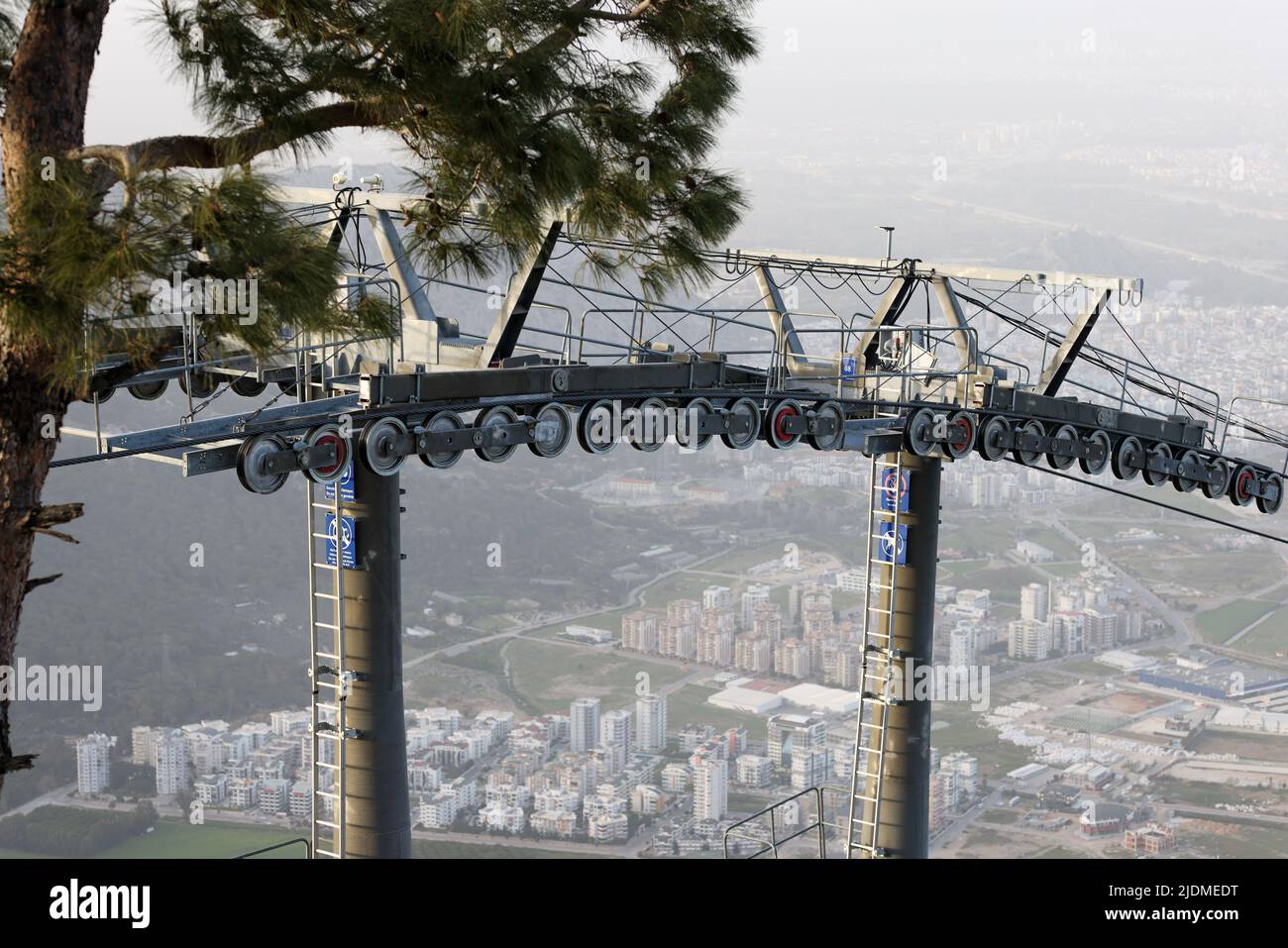 Cable car system above city in mountain landscape Stock Photo - Alamy