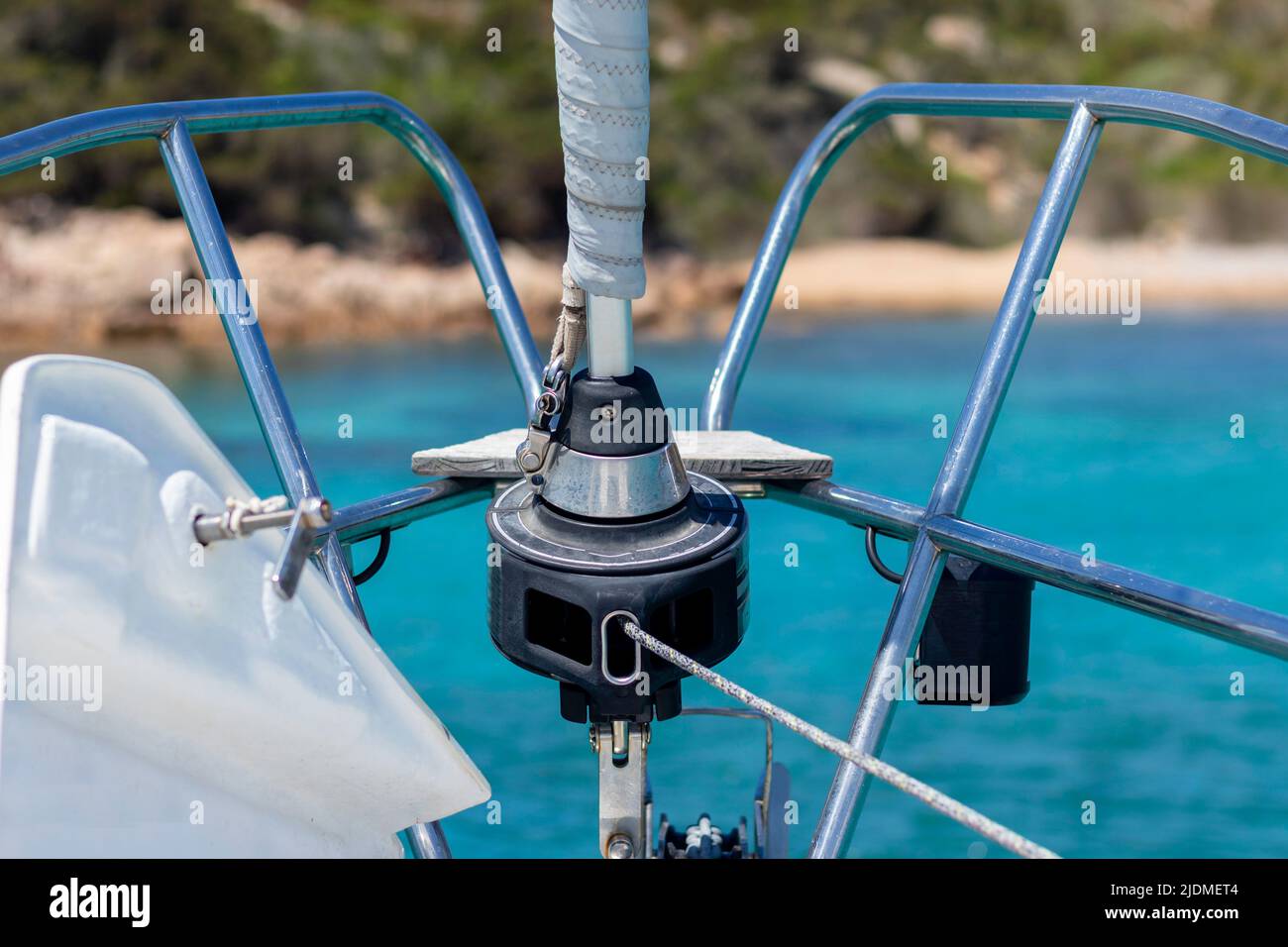 Sailboat bow with sail system and anchor to the view and unfocused ...