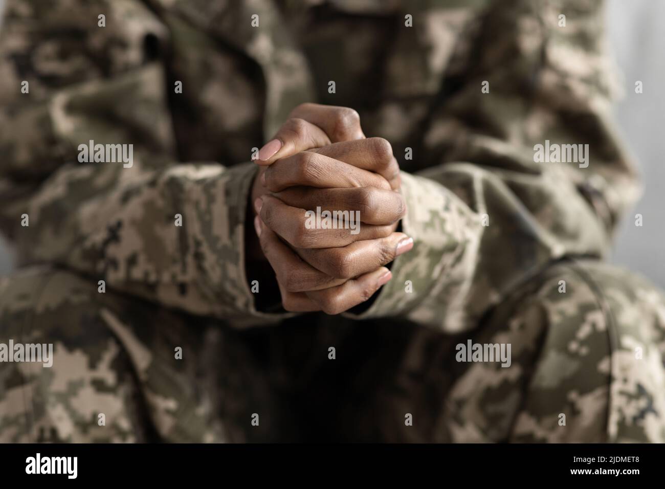 Closeup Shot Of Clasped Hands Of Unrecognizable Black Female Soldier In ...