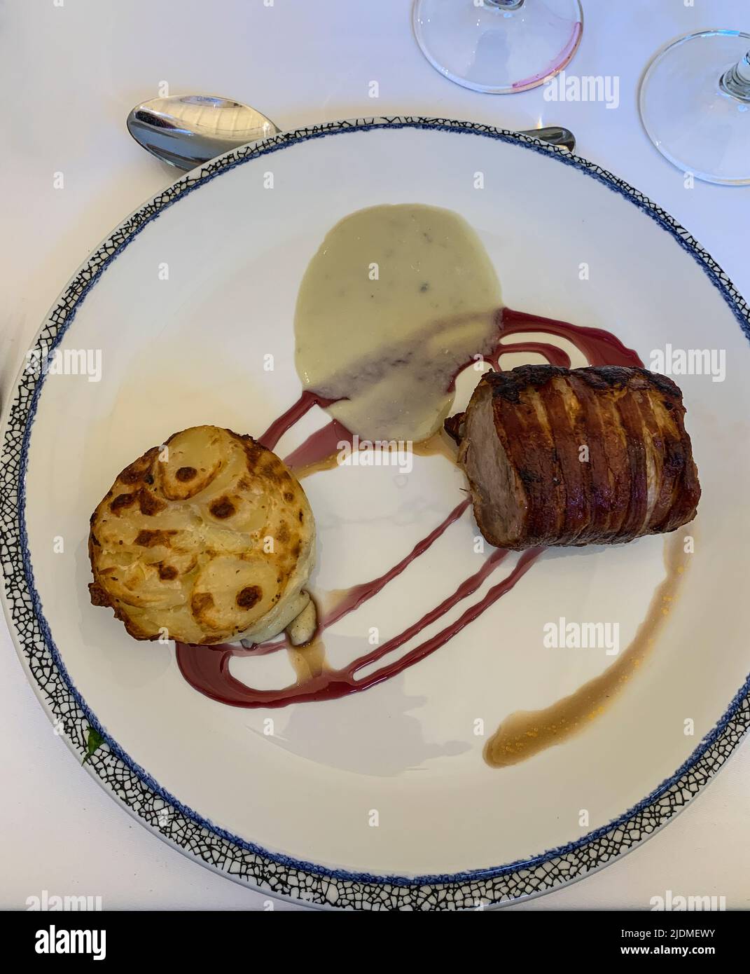 Spain, Spanish Cuisine. Pork filet Wrapped in Bacon with potato Gratin ...