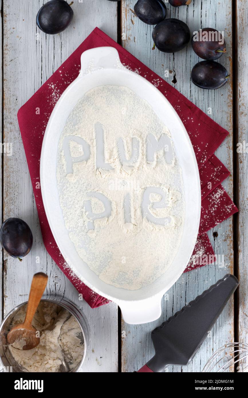 Recipe for grated pie with plum filling, top view, rustic style Stock ...