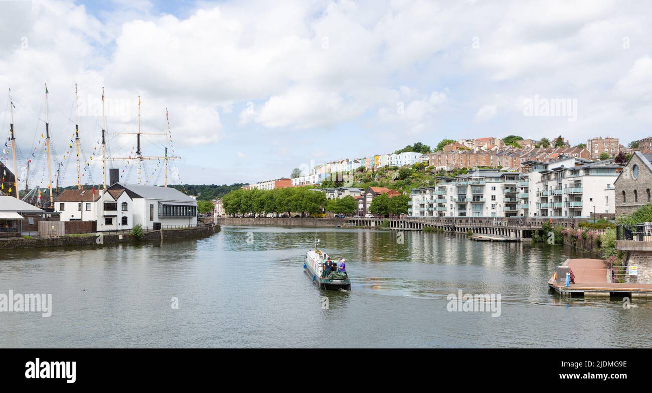 Narrow boat navigating through Bristol Docks, near the SS Great Britain ...