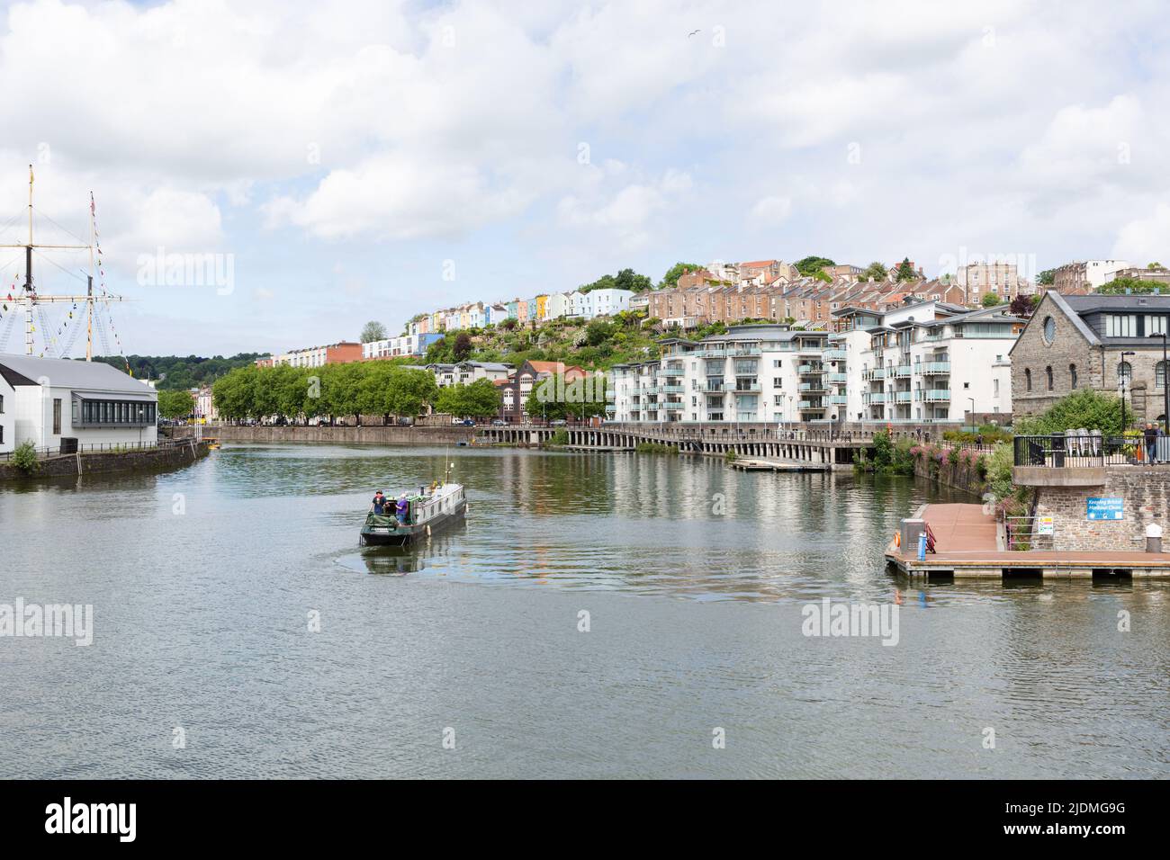 Narrow boat navigating through Bristol Docks, near the SS Great Britain ...