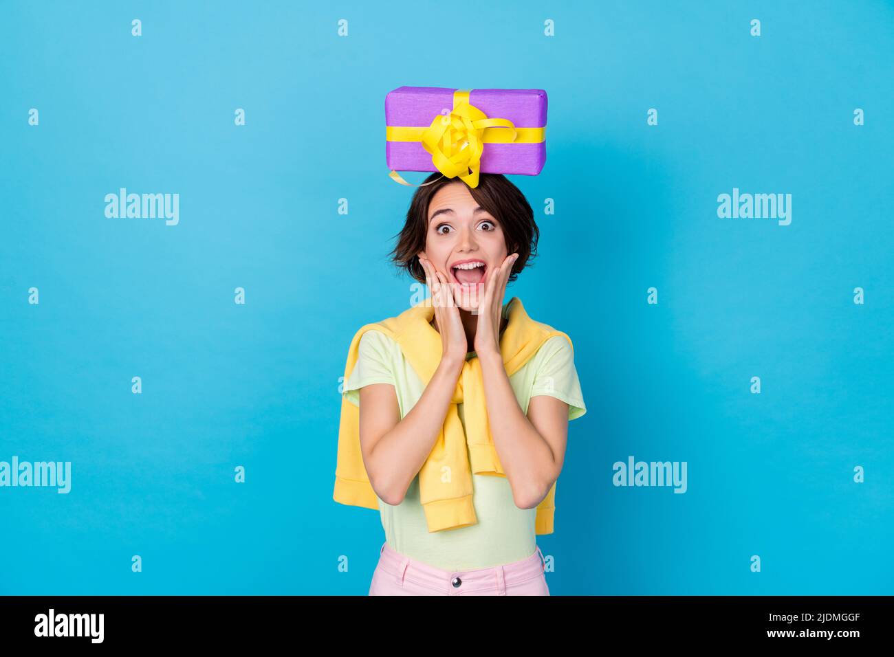 Photo of shocked excited lady dressed yellow pullover arms cheeks ...