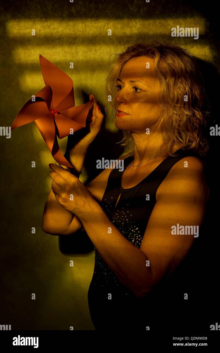 Girl with a pinwheel hi-res stock photography and images - Alamy