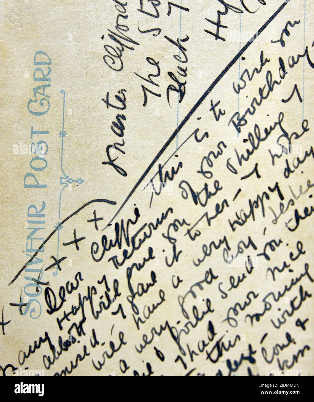Handwriting or hand writing or written text on an antique postcard ...