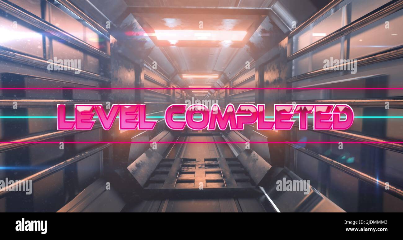 Image of level completed text over digital tunnel Stock Photo - Alamy