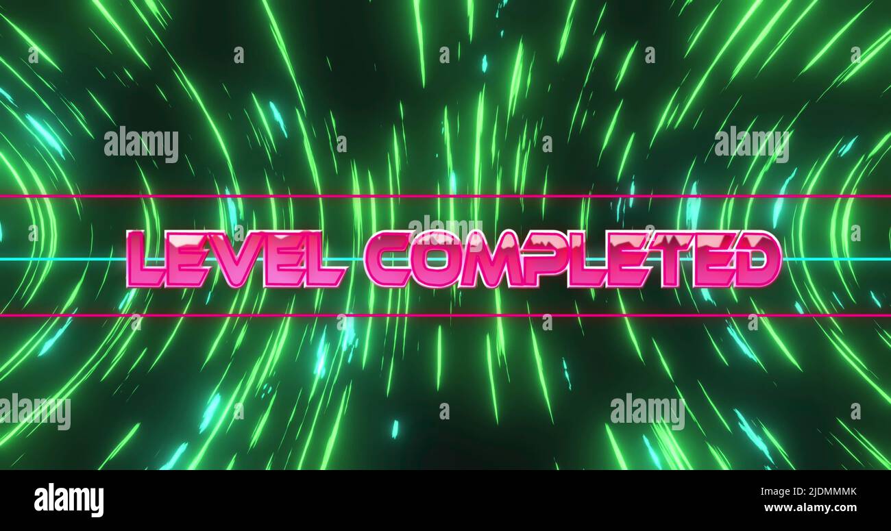 Image of level completed text over green trails of lights Stock Photo ...