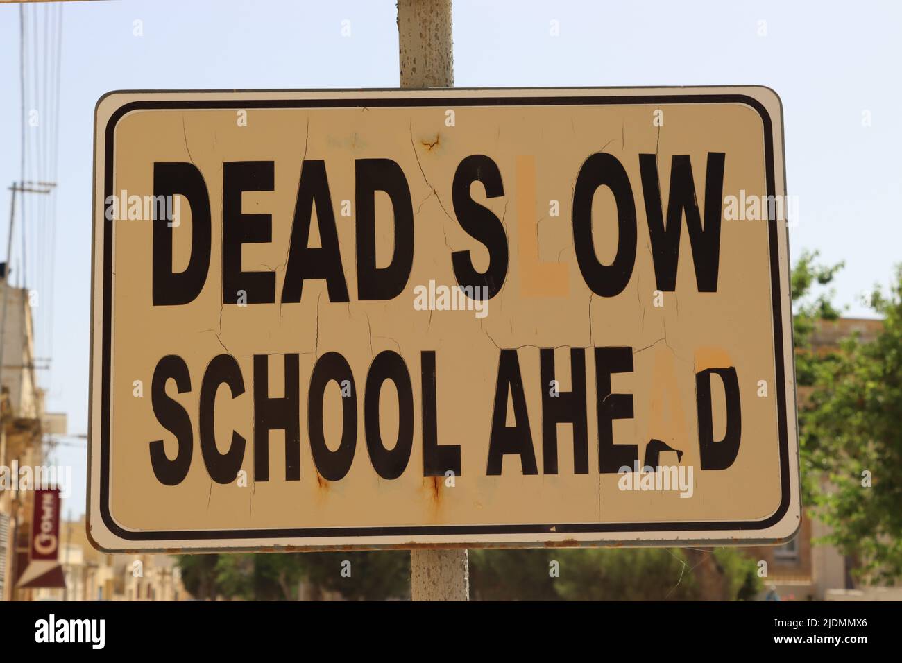 A road sign with missing vinyl letters, resulting in a humorous message ...