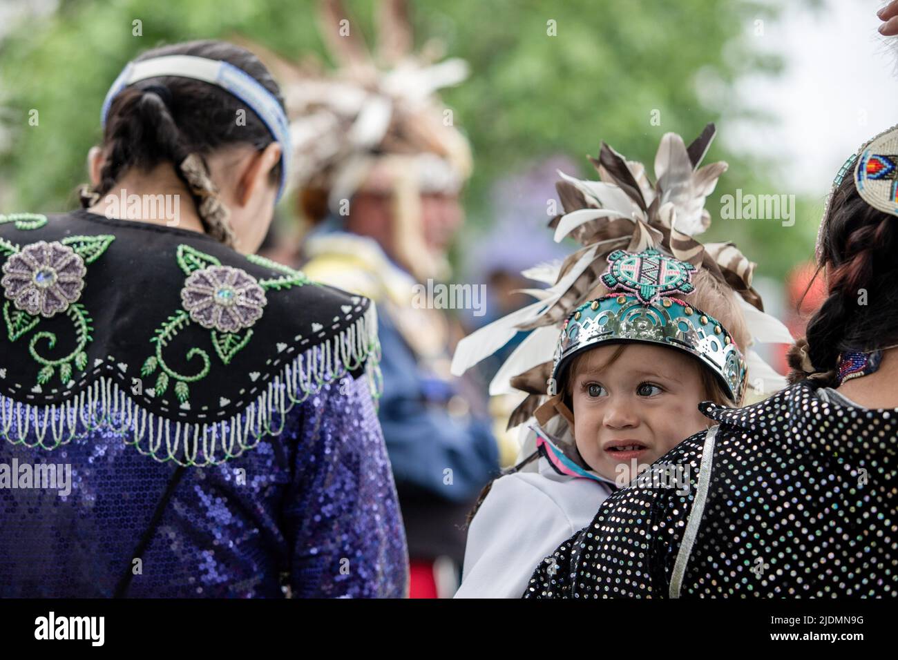 A baby among its people during the celebration of the summer solstice ...