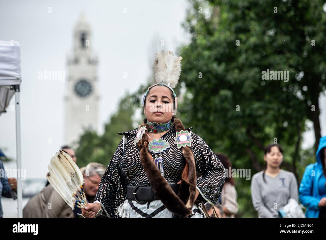 An Indigenous dancer showing her traditions near the Quai de l'Horloge ...