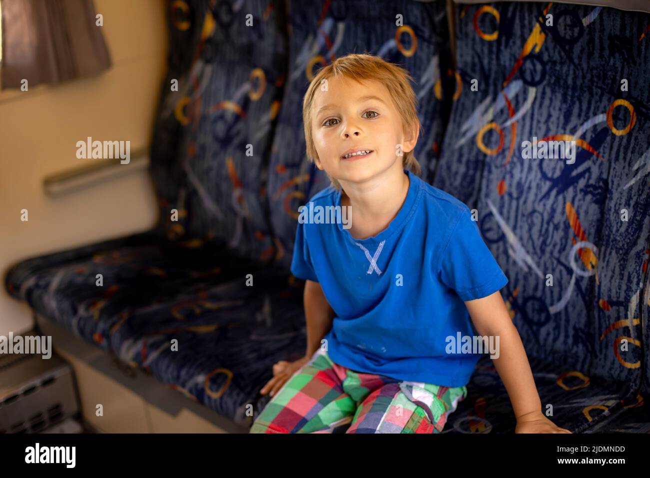 Cute little child, boy, traveling on a train, summertime Stock Photo ...