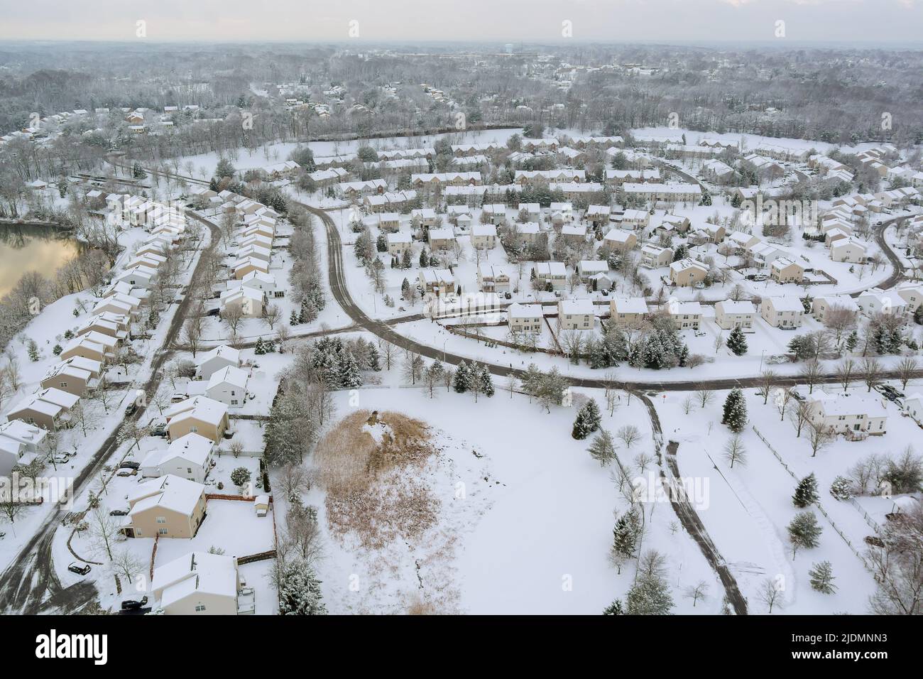 After a severe snowfall, an aerial view of a small towns hometown can ...
