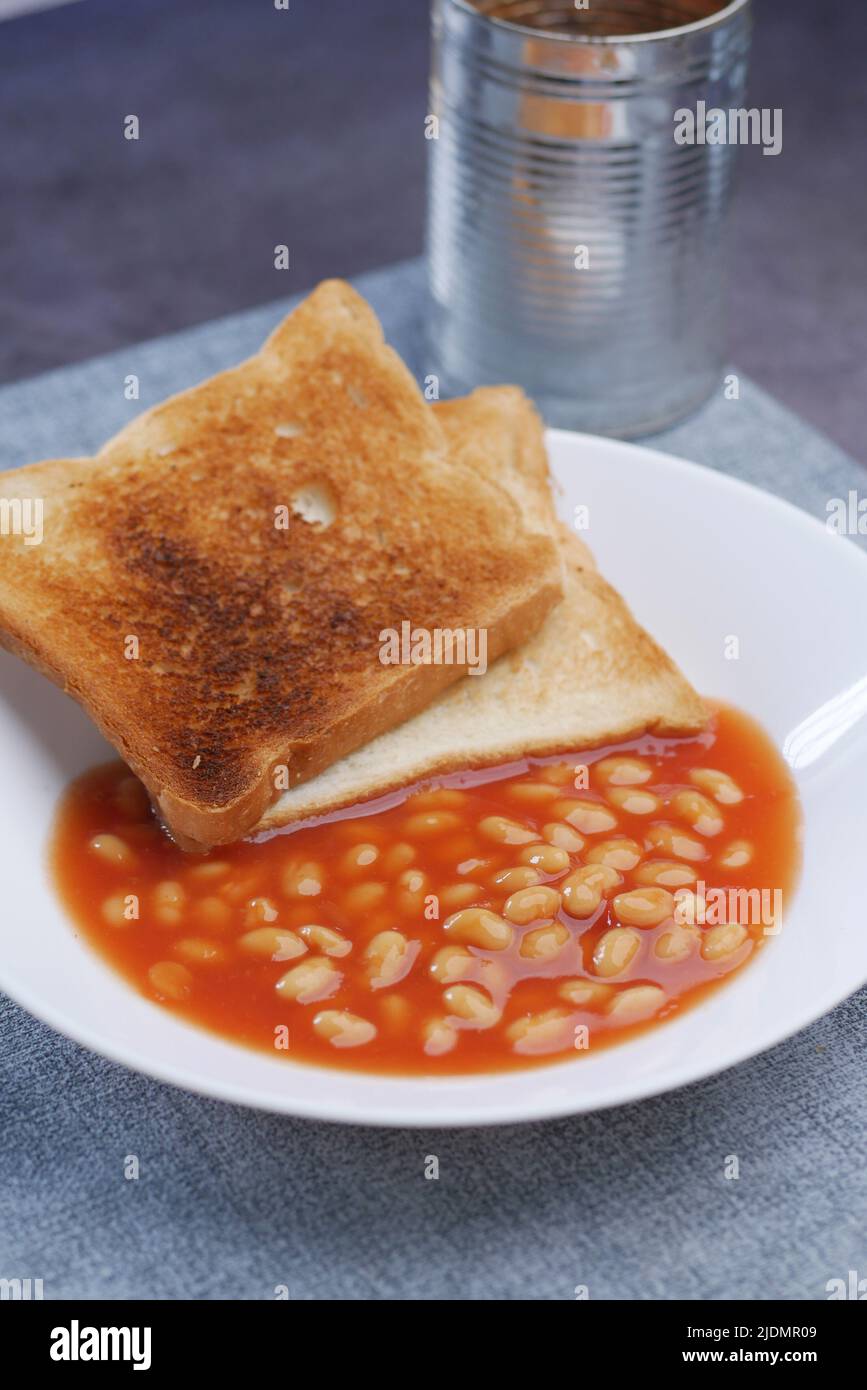 Tasty baked beans, egg and bread for morning break fast Stock Photo - Alamy