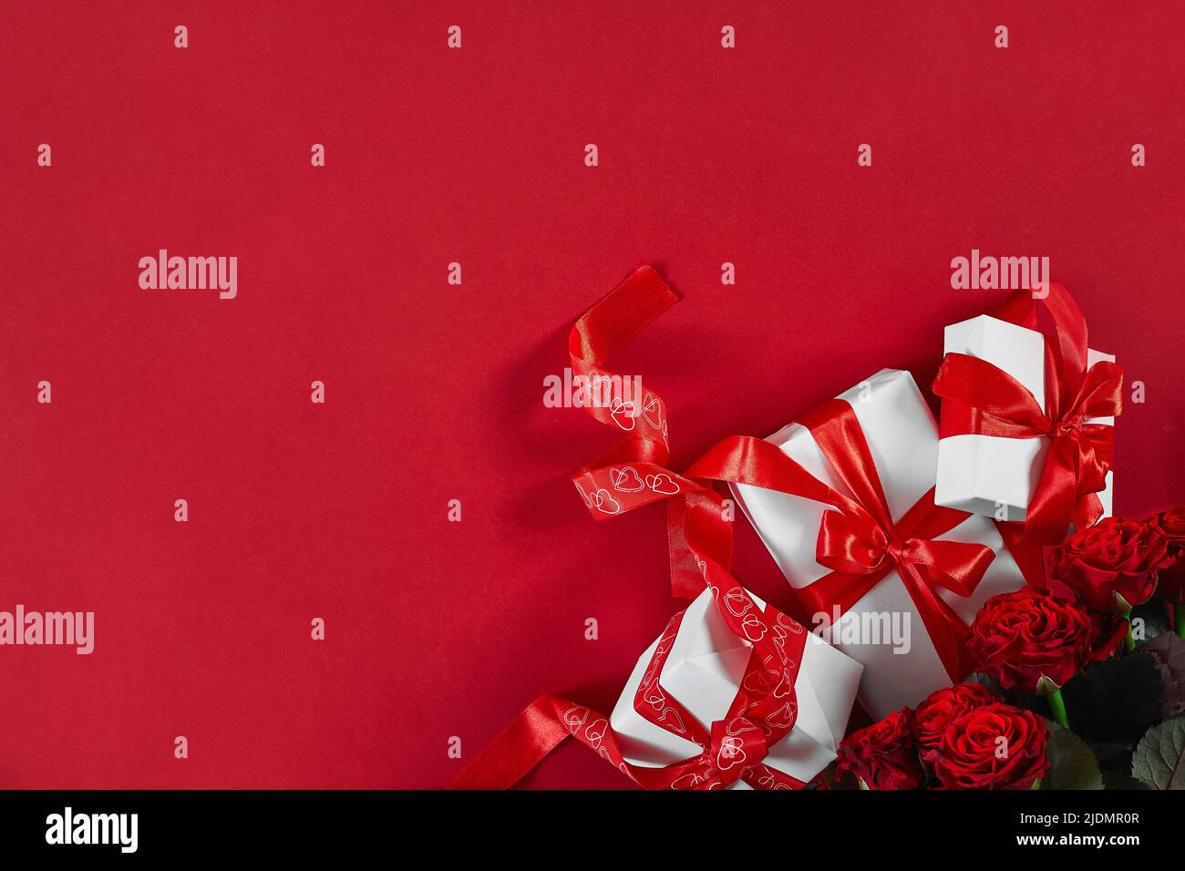 Top view fresh red rose flower and gift box on red deck with emp Stock ...