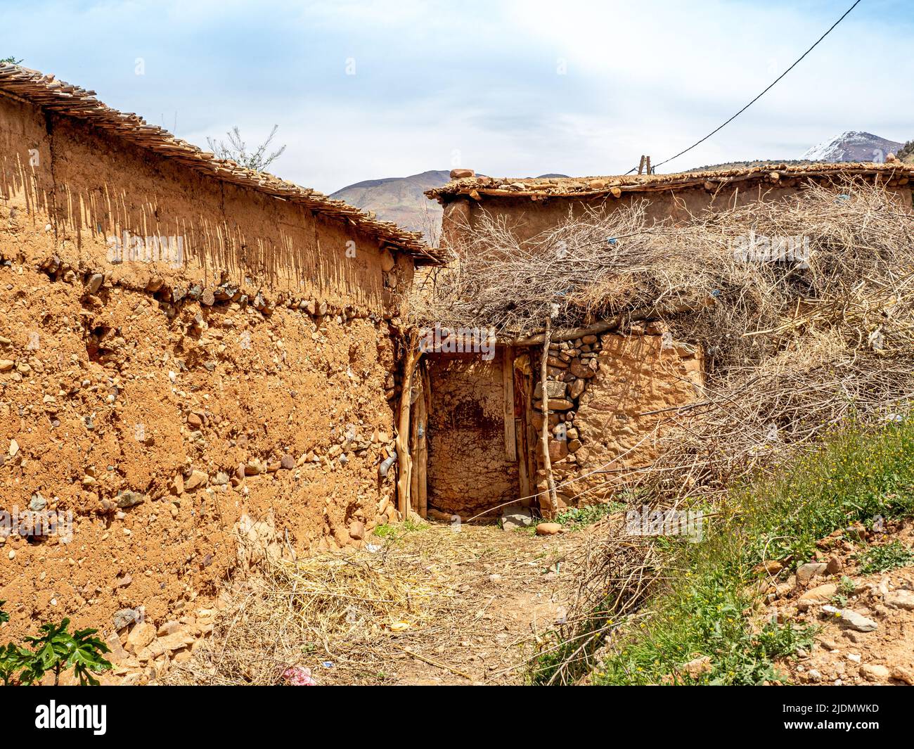 Berber family village with walls made from stones and clay, and doors ...