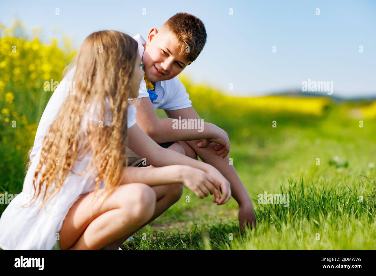 Native joyful teenage children enjoying warm weather: big strong kind ...