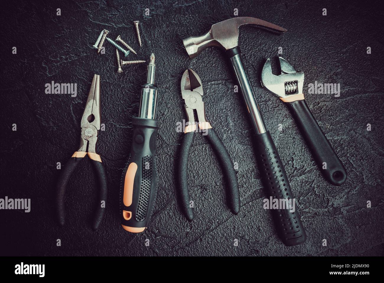 Tools for master builder on a black background Stock Photo - Alamy