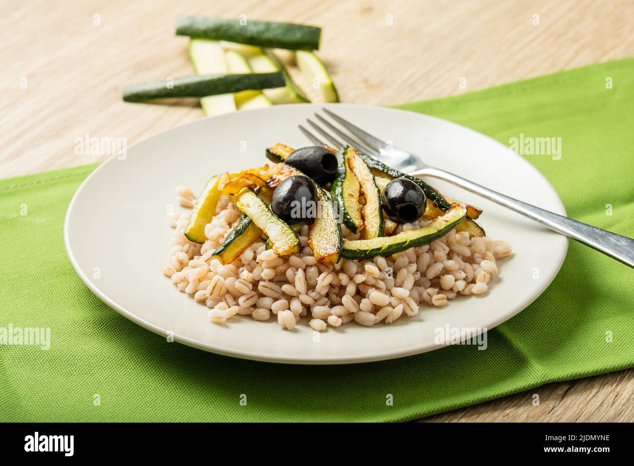 Pearl barley salad with zucchini, tuna and olives Stock Photo - Alamy