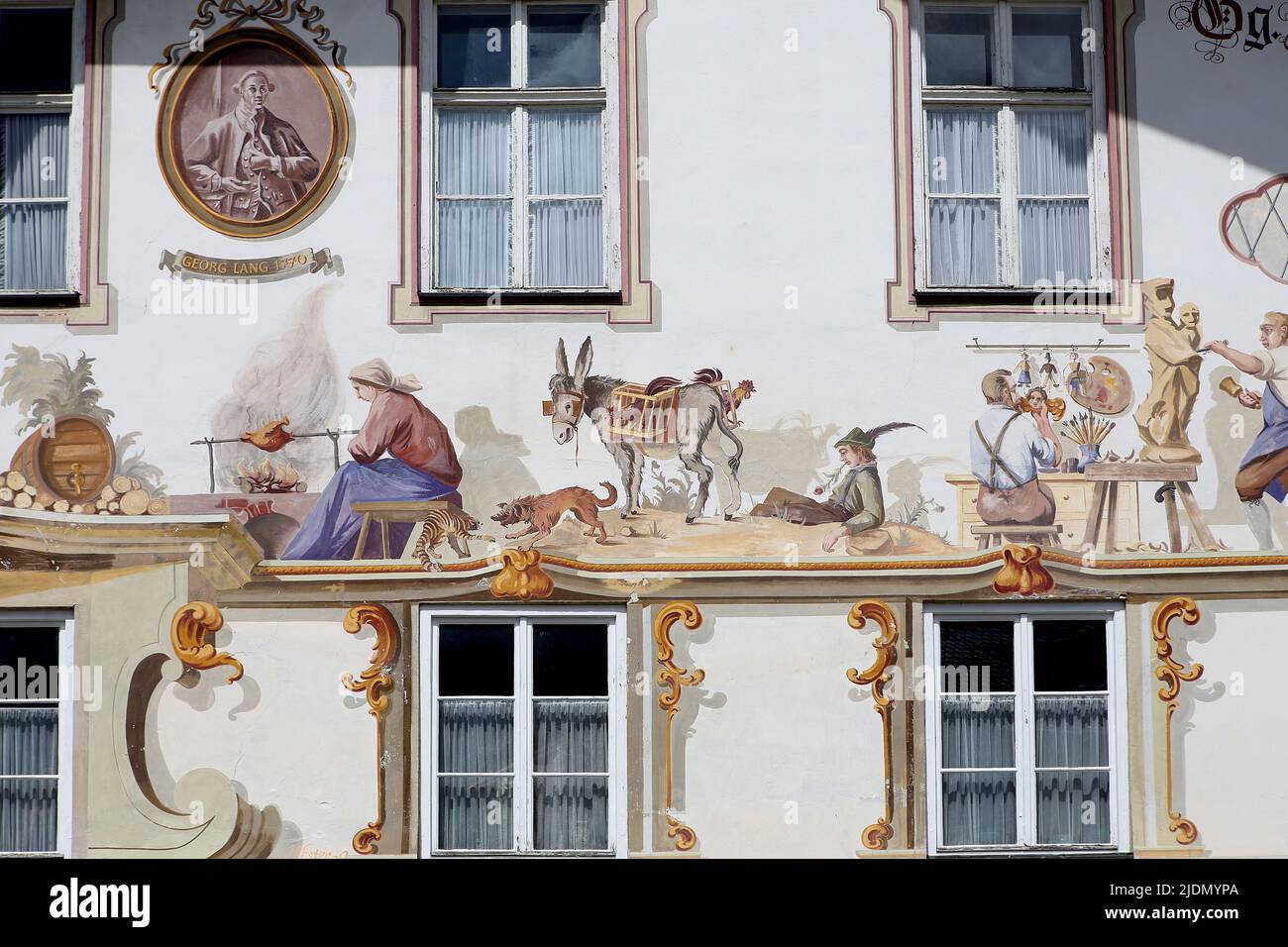 Mural paintings on houses facades in the streets of Oberammergau ...