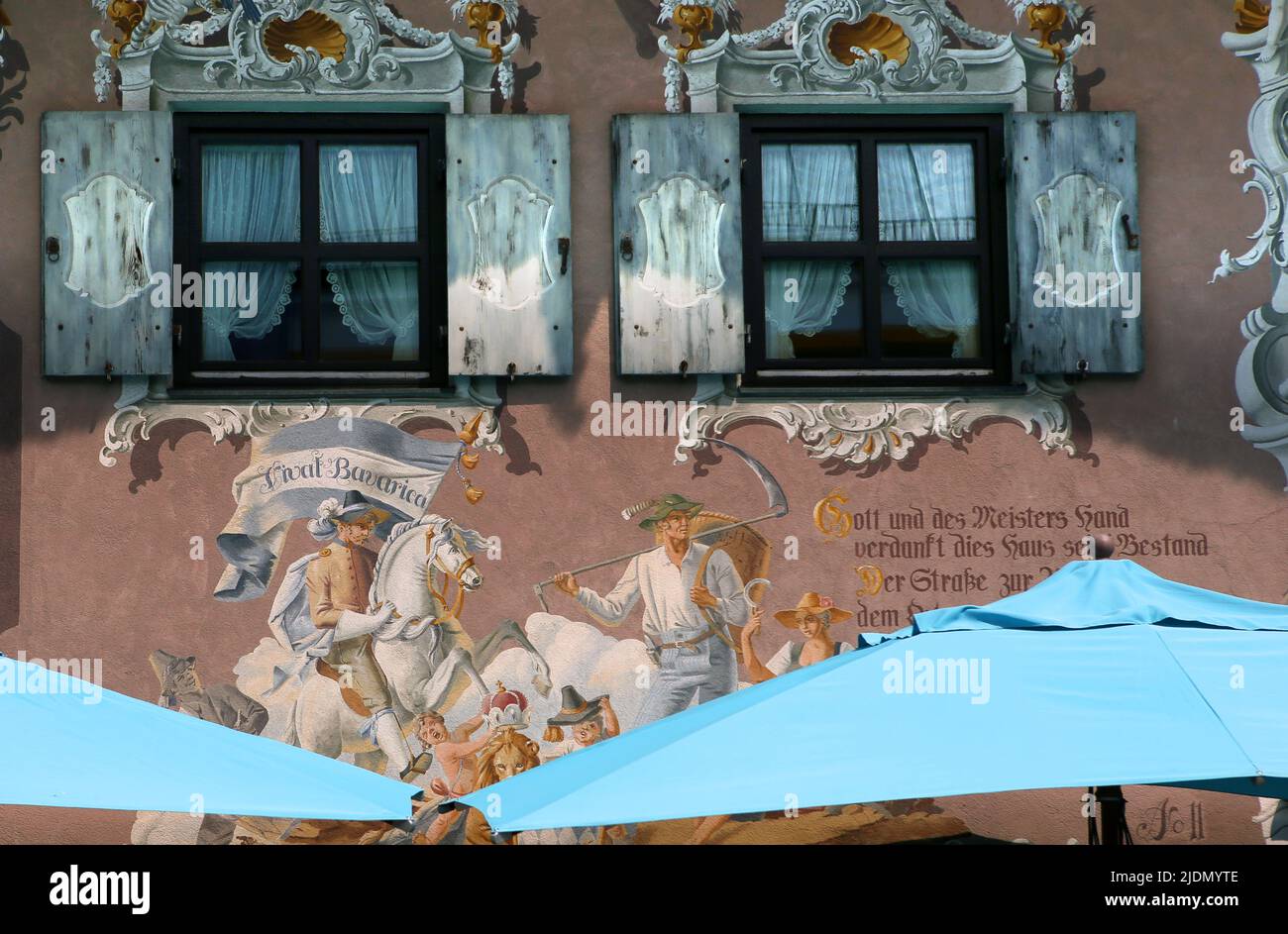 Mural paintings on houses facades in the streets of Oberammergau ...