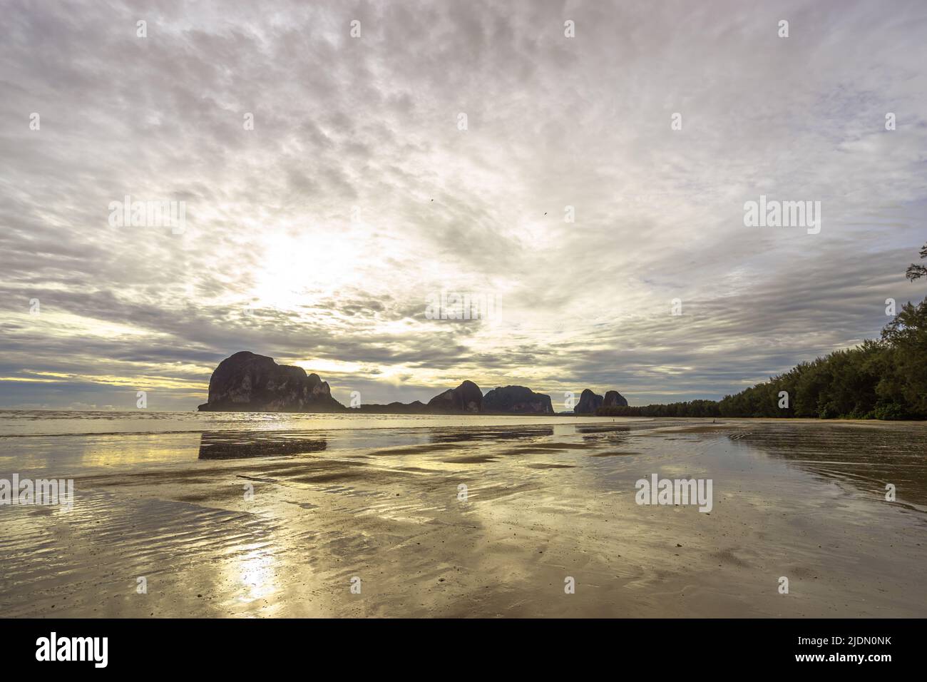 Beautiful sunset time scenic at the beach by.the light shading into the ...