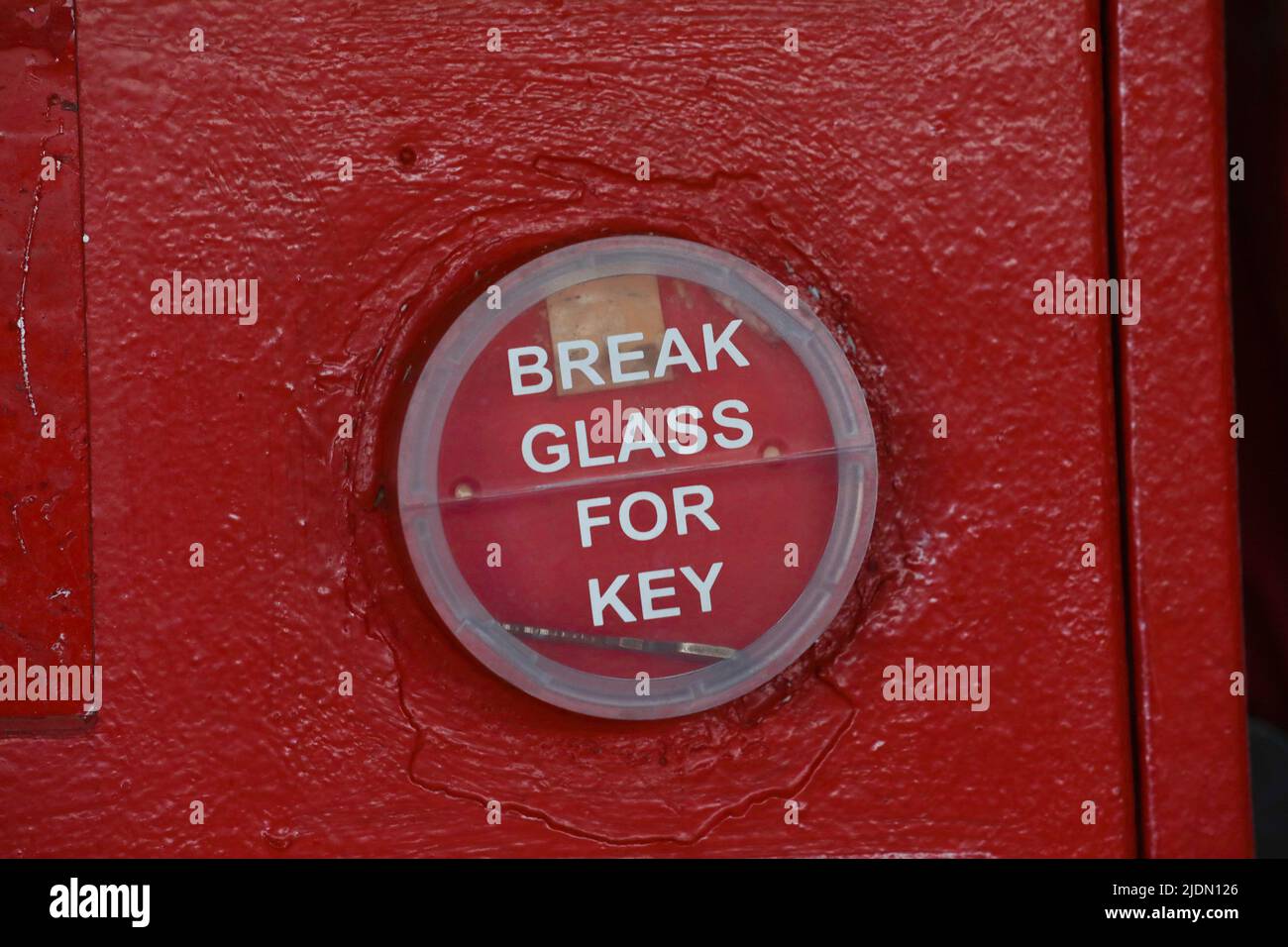 A sign with a key inside for security Stock Photo - Alamy
