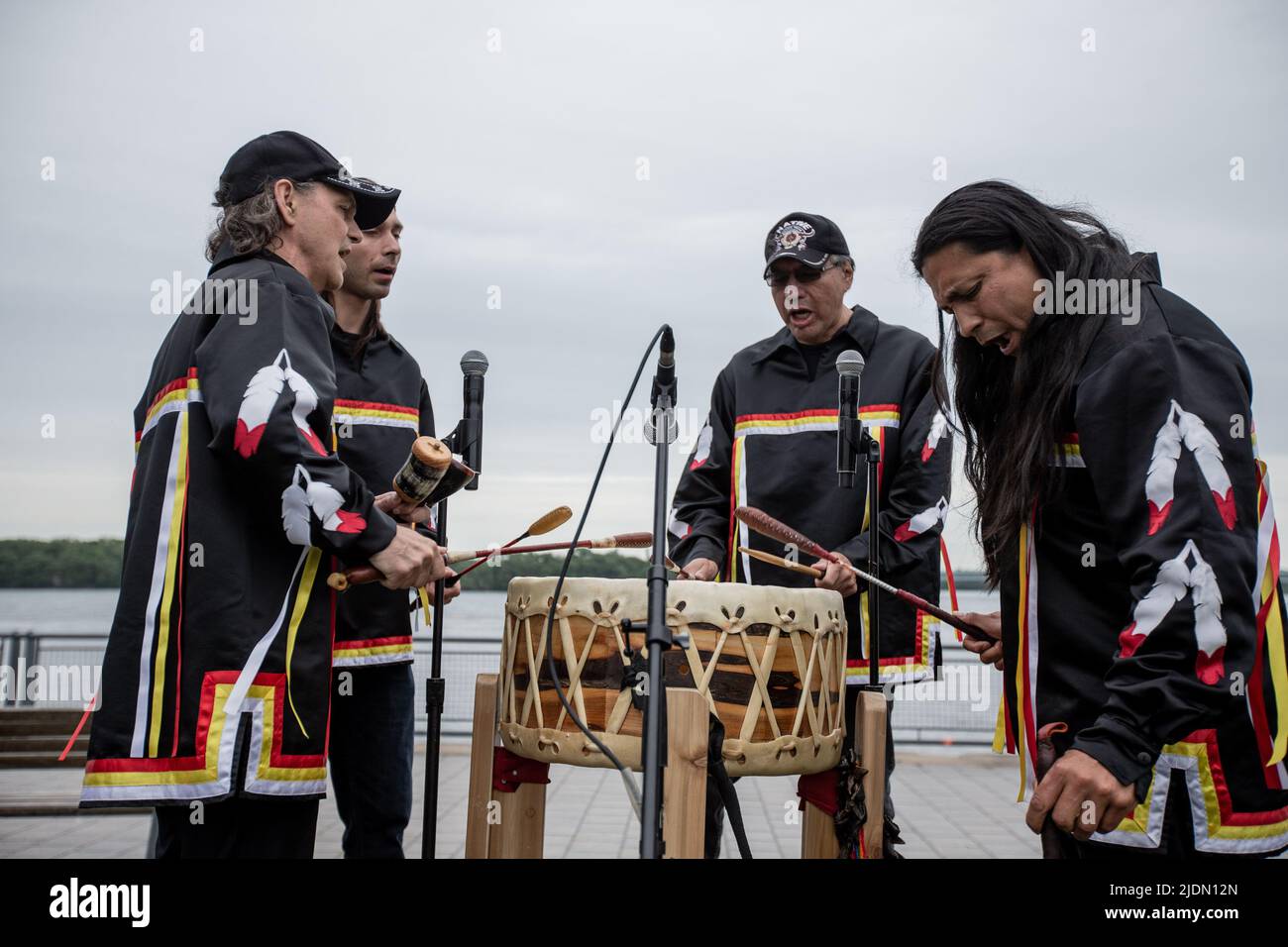 Members of the Buffalo Hat Singers' band perform during the ...