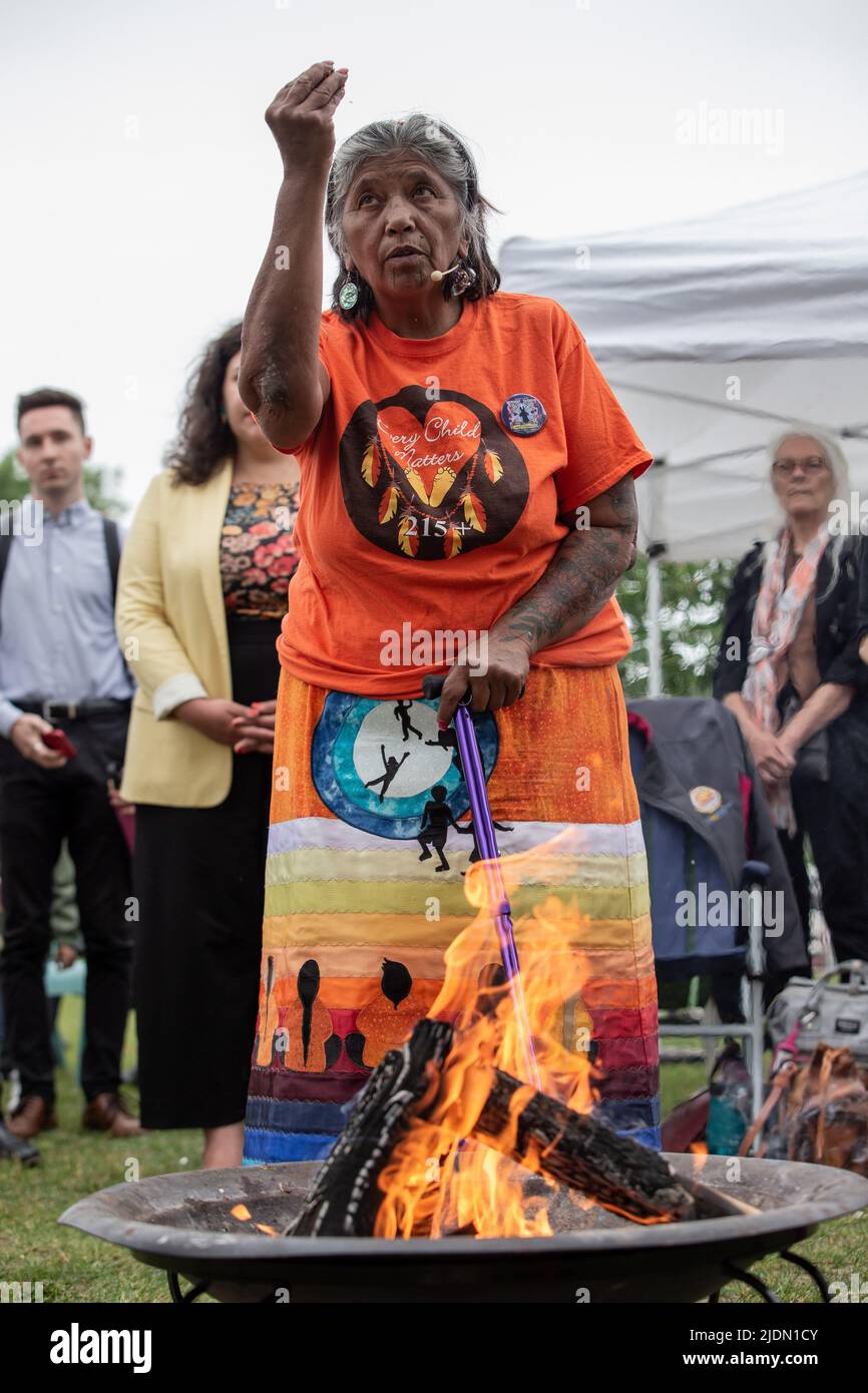 An Indigenous elder starts the ceremonial fire to celebrate the summer ...