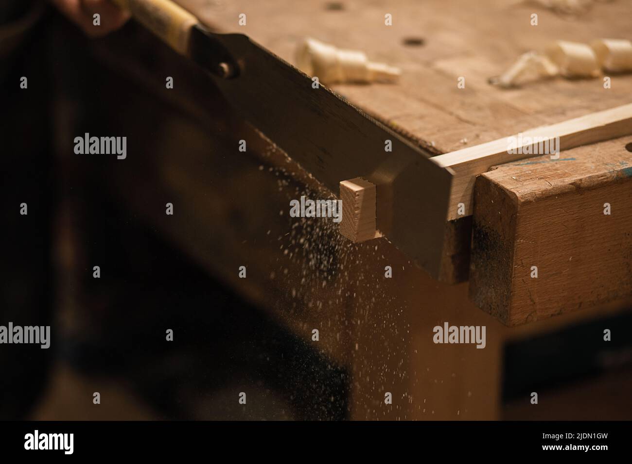 Unrecognizable carpenter worker sawing and using chisel or rasp with ...