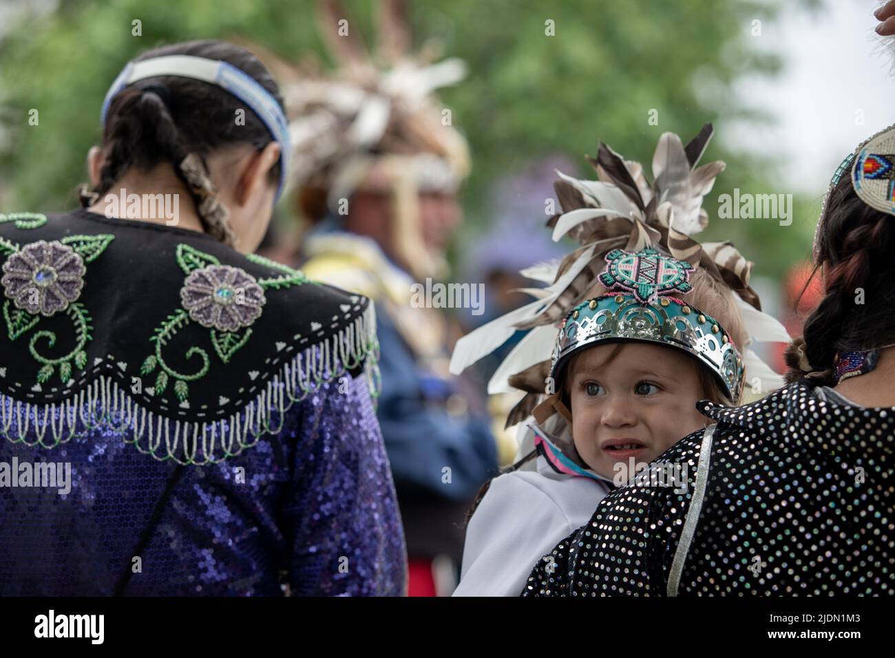 A baby among people during the celebration of the summer solstice Stock ...