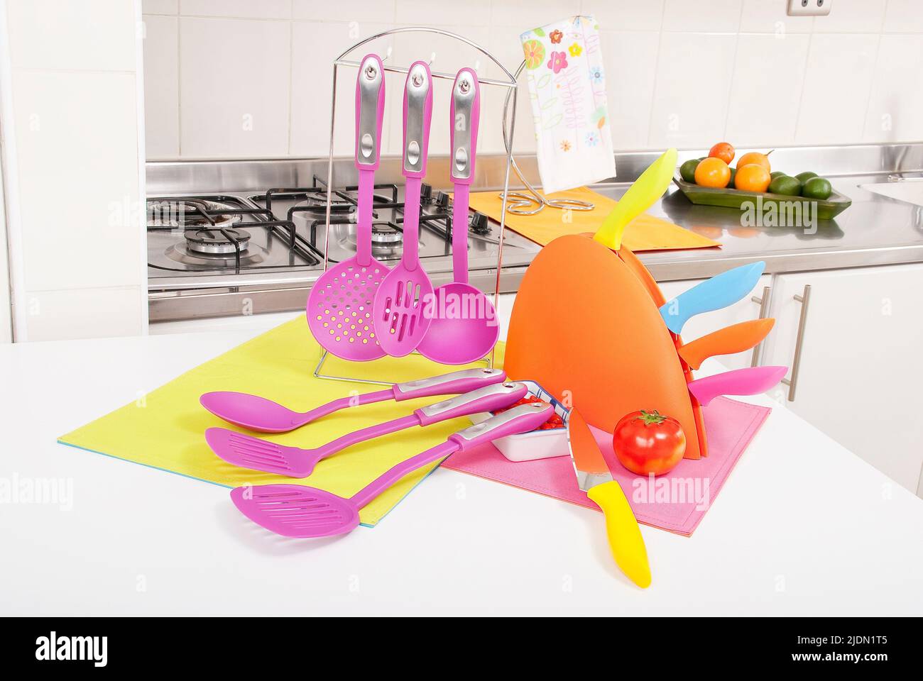 Kitchen tools; set of plastic ladles and knives colorful Stock Photo ...