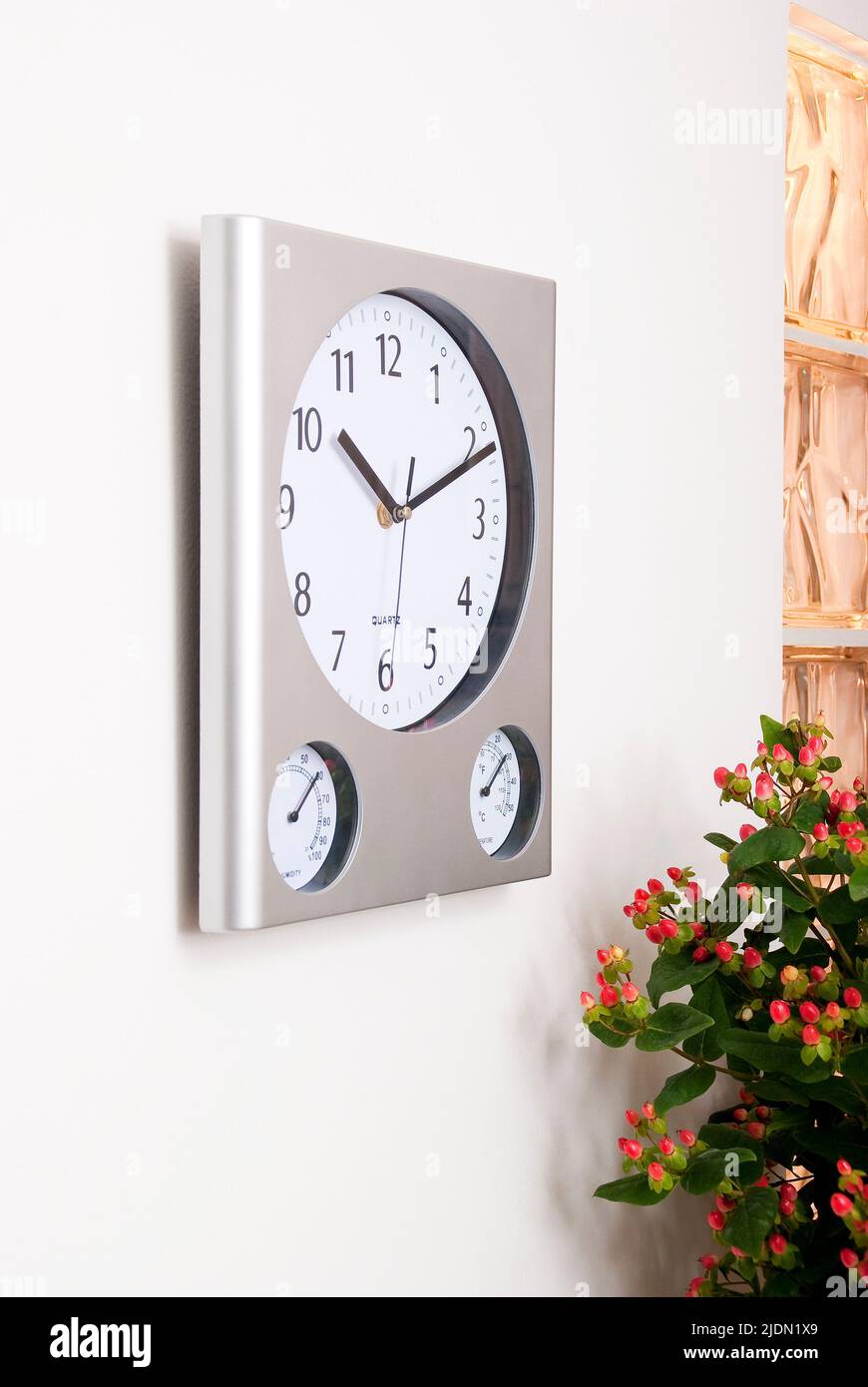 Home decoration; grey wall clock Stock Photo - Alamy